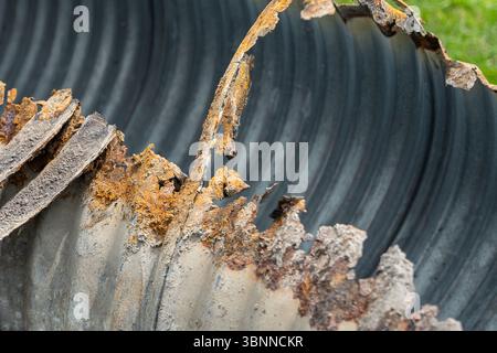 Infrastructure photo of rusted out corrugated metal pipe, CMP, drainage ...