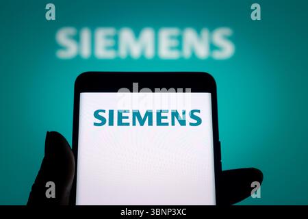 In this photo illustration, a Siemens logo is seen displayed on a ...