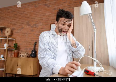 Electrocuted young man with burnt face at home Stock Photo - Alamy