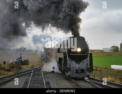 An Antique Restored Steam Freight Train Approaching Head on Blowing ...