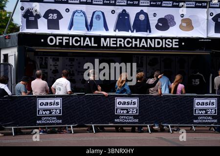 Oasis fans queue outside the stadium ahead of the first night of the ...