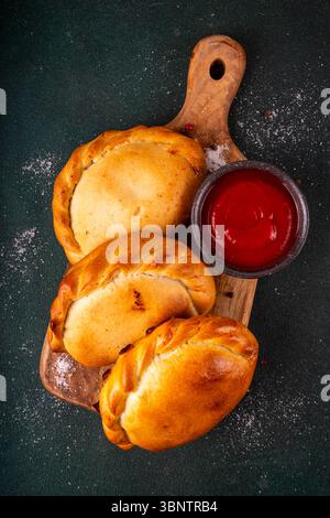Hand pies. Mini puff pastry or hand pies stuffed with apple and ...