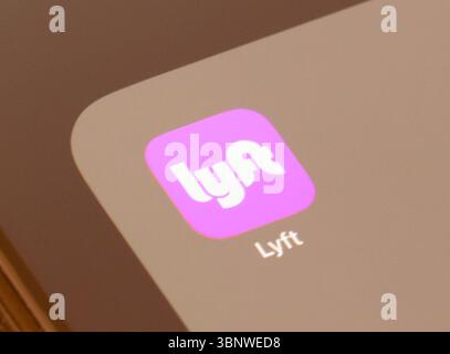 Lyft ride sharing app on smartphone screen with VISA card for payment ...