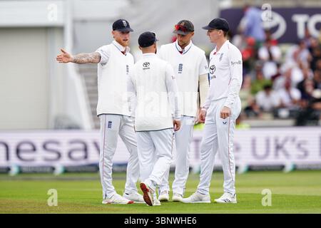 England’s Ben Stokes (left) and England’s Ben Duckett (right) share a ...