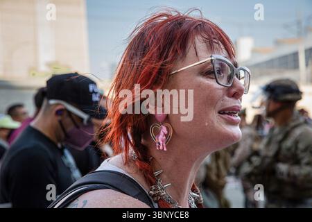 Los Angeles, USA. 05th July, 2025. A DHS agent pushes a demonstrator in ...