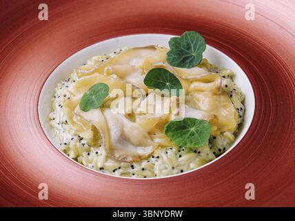 Grilled fillet of trout fish served with fresh vegetables and greens ...