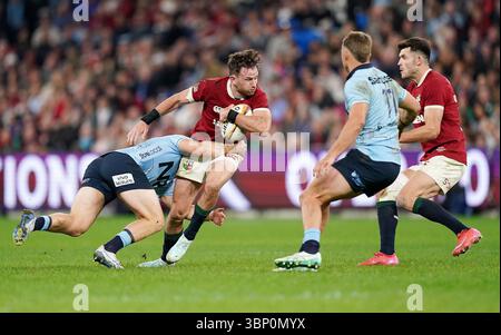 Hugo Keenan (centre) of the British and Irish Lions celebrates a series ...