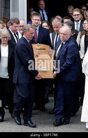 The remains of Brother Kevin Crowley are brought from St. Mary of the ...