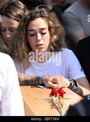 Diogo Jota's wife Rute Cardoso walks with the coffin after the funeral ...