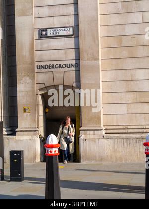 Pedestrians walk past the Bank Station Underground exit on Threadneedle ...