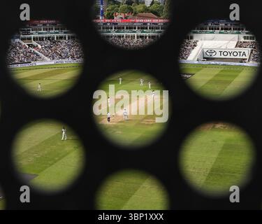 Joe Root and Ollie Pope of England chat as they leave the field at the ...