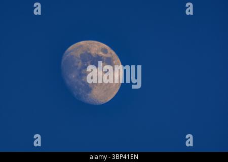 The waning gibbous Moon is visible above Earth’s horizon as the ISS ...
