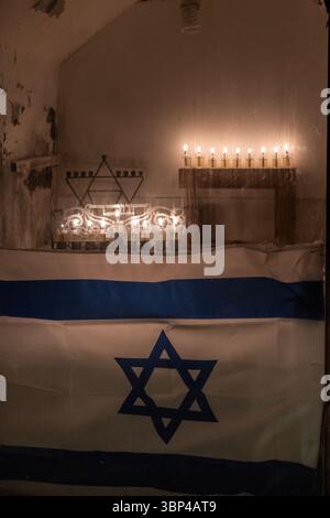 Israeli flag and burning candles in front of it, Holocaust memory day ...