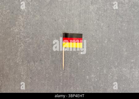 A small Germany flag on an abstract blurry background Stock Photo - Alamy
