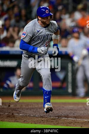 Chicago Cubs' Carson Kelly (15) scores after hitting a home run during ...