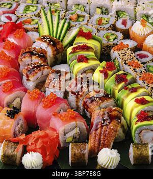 Big set of japanese food sushi maki rolls on wooden board Stock Photo ...