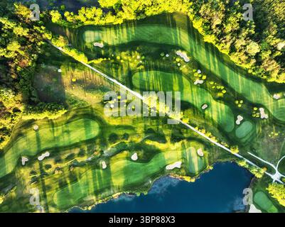 Golf course at sunset with beautiful dramatic sky. Scenic panoramic ...
