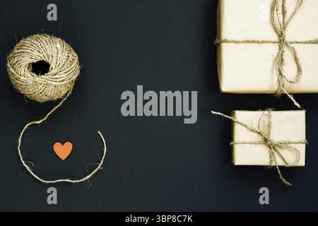 Handcrafted gift box wrapped in Craft paper with red wooden heart, rope ...