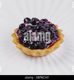 Freshly baked blueberry tart on a blue porcelain plate Stock Photo - Alamy