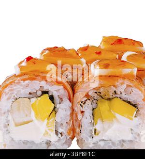 Sushi rolls with salmon, mango, cream cheese and sauce are standing in ...