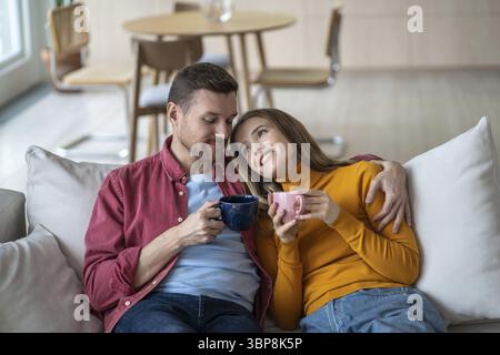Relaxed man and woman spending weekend at home Stock Photo - Alamy