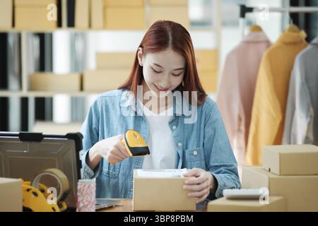 Scanning barcode on shipping label with handheld scanner. Order ...