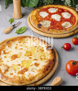 Four cheese pizza served basil Stock Photo - Alamy