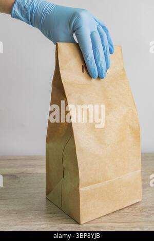 Covid, pandemic and real estate concept. Excited young man in medical ...