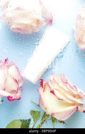 White tube of cosmetic cream with flowers on yellow background. Flat ...