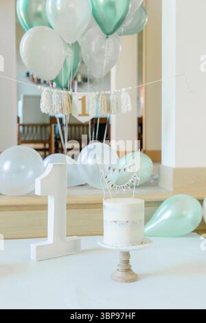Elegant Balloons and Cake Setup for First Birthday Celebration Stock ...