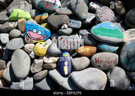 Love stone messages near the ancient church of St Tanwg situated in the ...