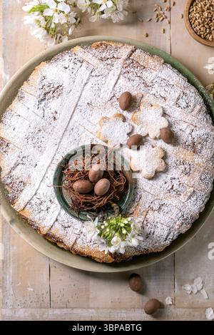 Easter cake with rustic decoration, wheat on wooden table the holiday ...