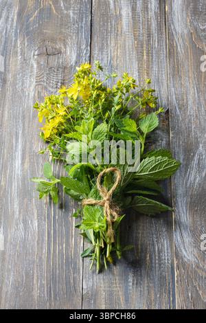 Fresh medicinal herbs on wooden background Stock Photo - Alamy