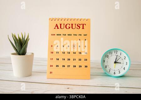 Cube shape calendar for August 07 on wooden surface with empty space ...