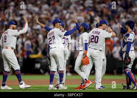 New York Mets players celebrate after winning a baseball game against ...