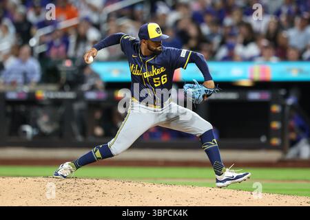 Milwaukee Brewers pitcher Grant Anderson attempts to pick off a base ...