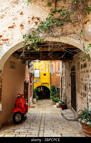 Stone arches, multi-color facades and winding, narrow streets of ...