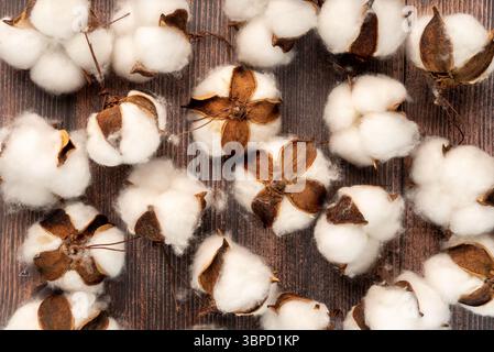 Scattered cotton buds on a wooden table Stock Photo - Alamy