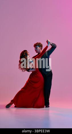 Elegant couple performing passionate Argentine tango dance pose in ...