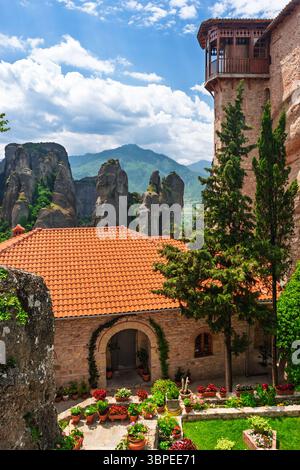 Meteora monastery courtyard, Greece. Mountains, flowers and beautiful ...