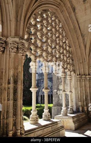 Intricate stone arches and columns in the beautiful cloister at Batalha ...