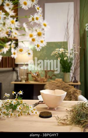 Table setting with chamomile flowers on grunge background Stock Photo ...