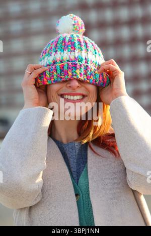 Young ginger happy woman laughing and making fun at camera isolated ...