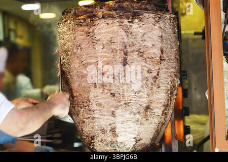 a doner kebab meat skewer, a popular fast food meal doner kebab, meat ...