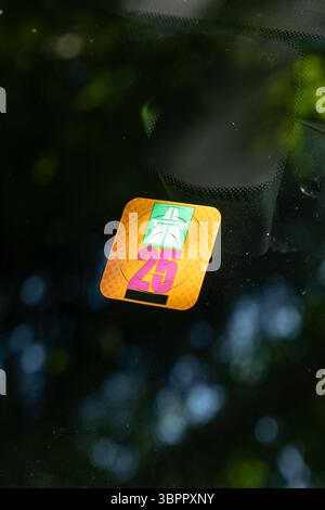 Swiss motorway toll sticker ("Vignette") at the windshield of a car in ...