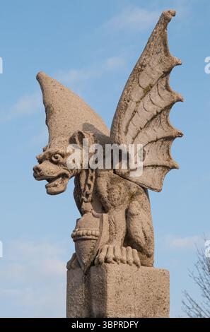 A gargoyle keeps watch over a cemetery Stock Photo - Alamy