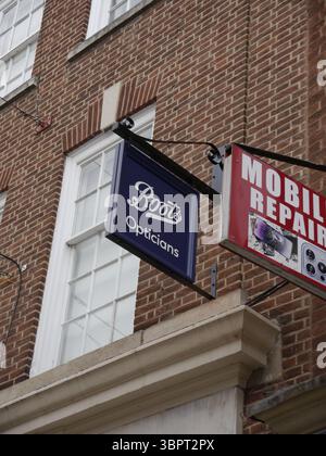 Boots opticians Corporate logo signs in York City centre in June 2025 ...
