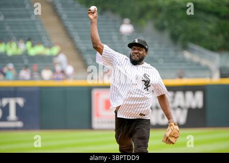 Comedian Corey Holcomb throws out a ceremonial first pitch before a ...