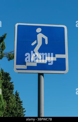 A blue sign of entrance to the underpass. symbol for subway metro ...