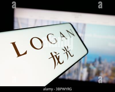 Stuttgart, Germany - 05-07-2025: Person holding smartphone with logo of ...